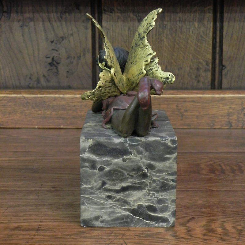 Bronze Lidell fairy laying down on marble base
