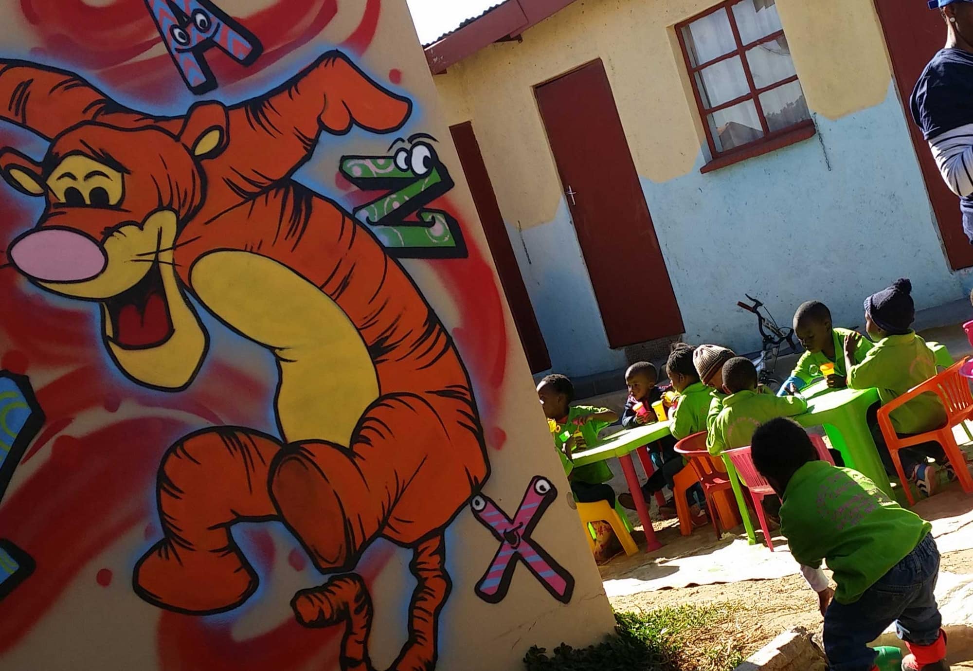 How to decorate a children's creche with wall murals.