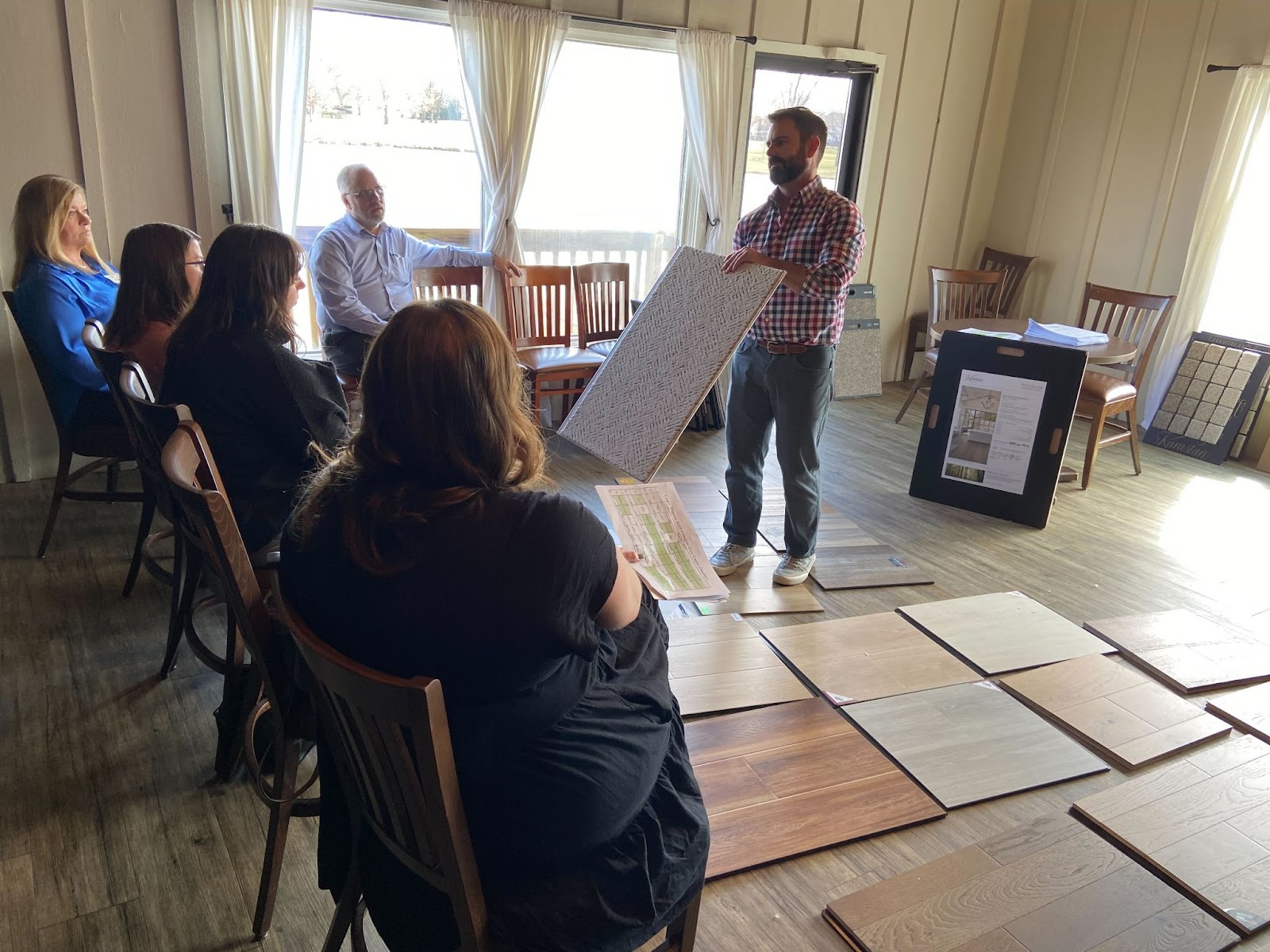 Carpet Weaver team discussing new flooring samples