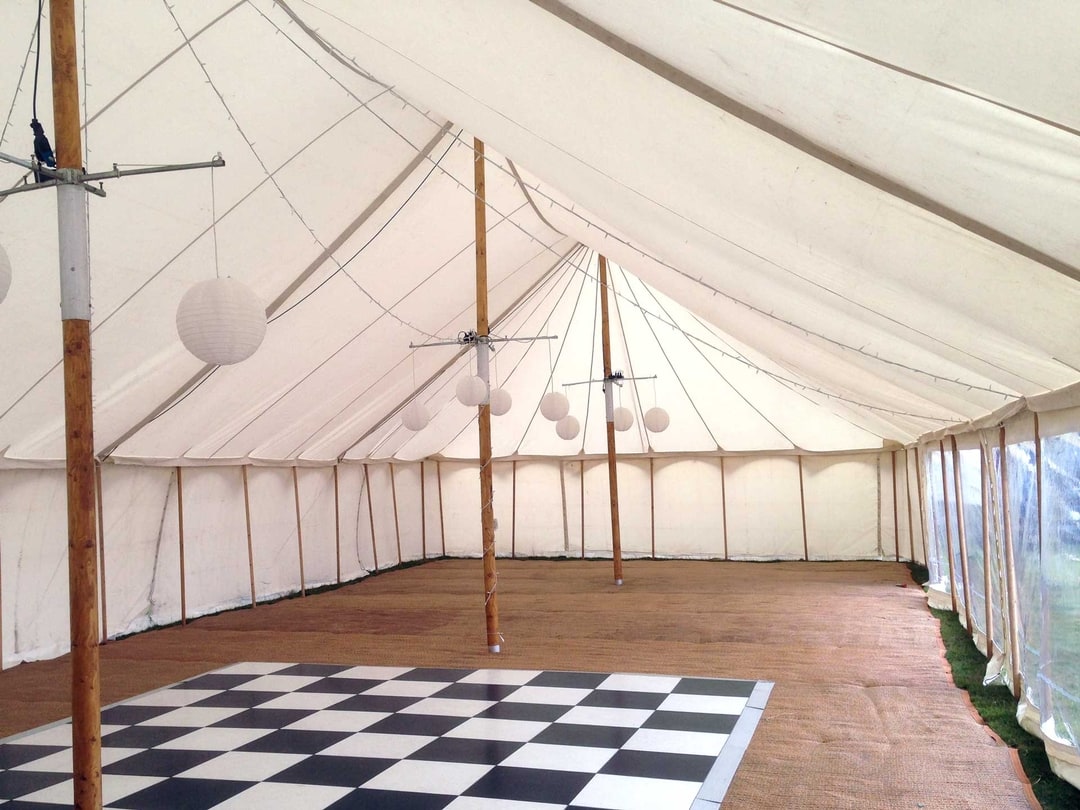 Weddings in traditional canvas pole marquees