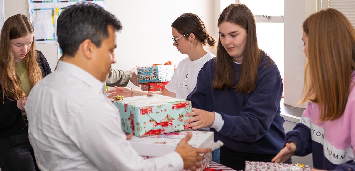 Deloitte interns volunteer and provide shoebox Xmas gifts