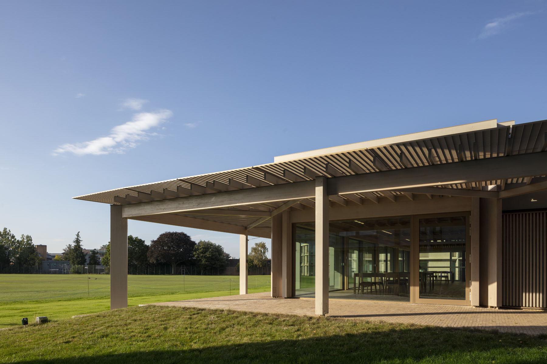 Xylotek - stacked chestnut beams Balliol College Sport Pavilion