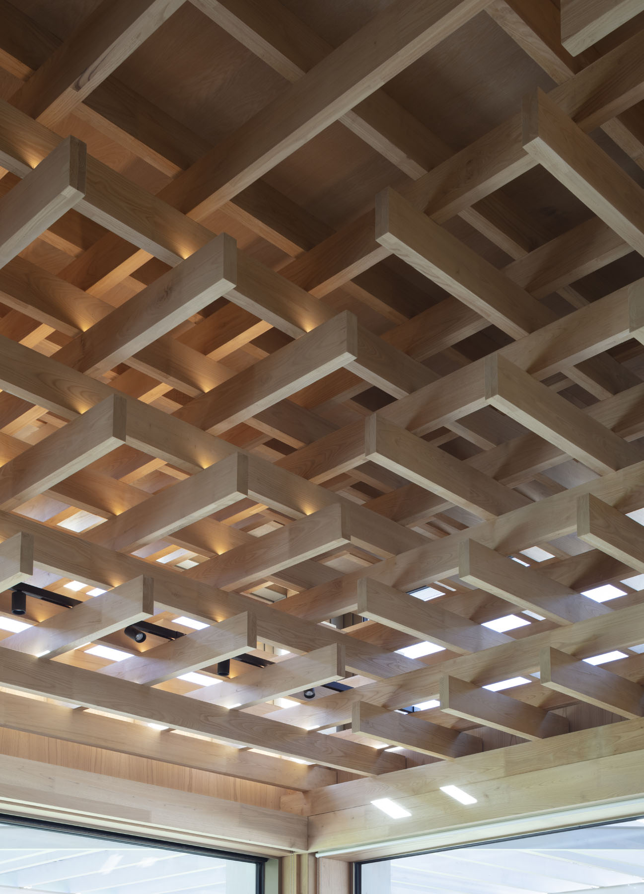 Xylotek - stacked chestnut beams Sport Pavilion - Balliol College Oxford