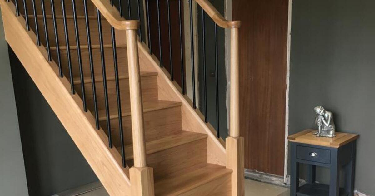 Solid Oak Staircase Incorporating Continuous Handrail With Black Iron ...